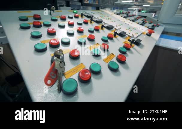 A dashboard in a control room. Special board with buttons is in a control room at a factory ...