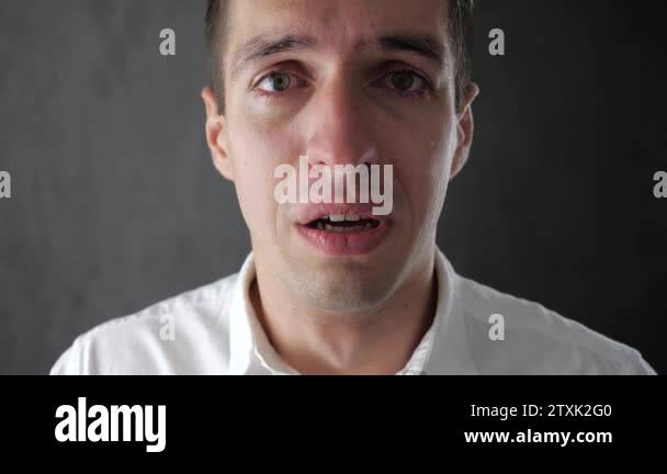 Portrait of sad man crying with tears in eyes. Depressed businessman ...