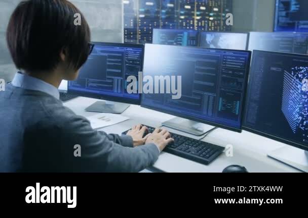 In the System Control Room Technical Operator Works at His Workstation ...