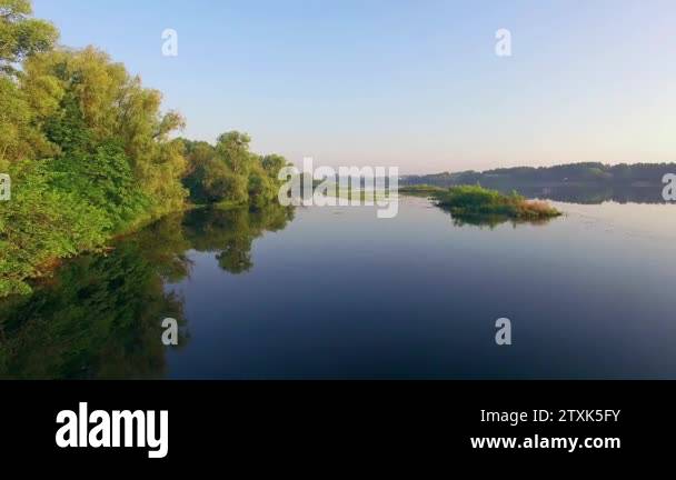 fly over island on the river 4K, 4K aeria view of island with reed ...
