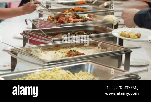 People group catering buffet food indoor in luxury restaurant with meat ...