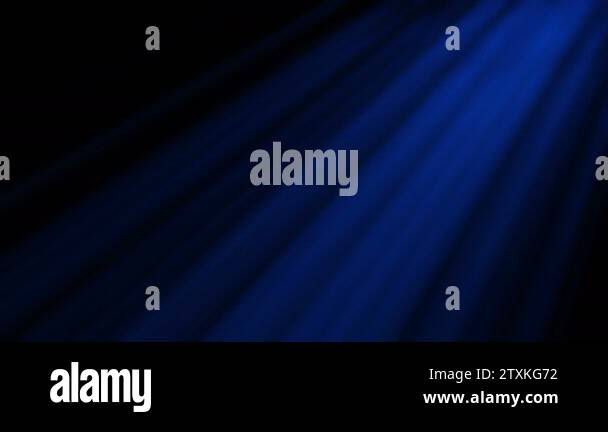 Volumetric rays of light shining from above penetrate through the thick ...