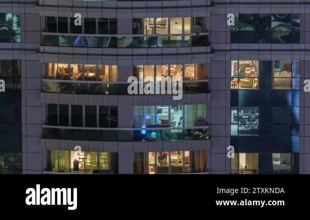 Night view of exterior apartment building timelapse. High rise ...