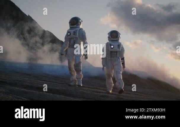 Two Astronauts in Space Suits Confidently Walking on Alien Planet, Exploration Expedition on the ...