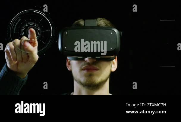 young nice man using 3d reality in life with oculus and augmented ...