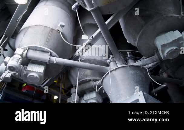 Close-up of pipelines and destillation tanks of an oil-refinery plant ...