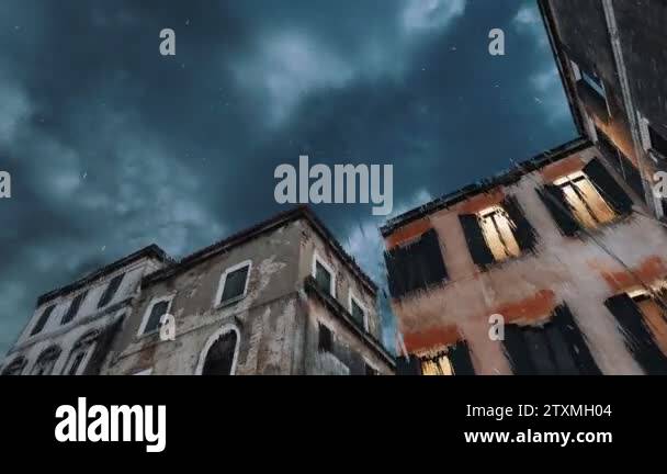 Looking up at ancient buildings against dull stormy sky with dark ...