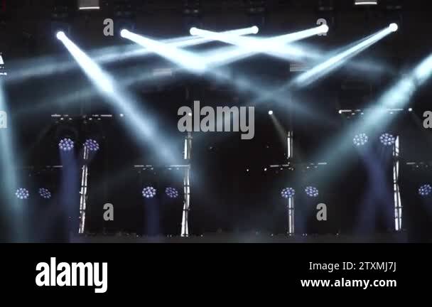 Stage lights are turned on during the concert blinking and shining ...