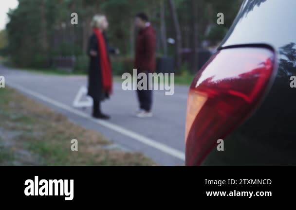 Two people swear on a background of warning triangle. Silhouette of ...