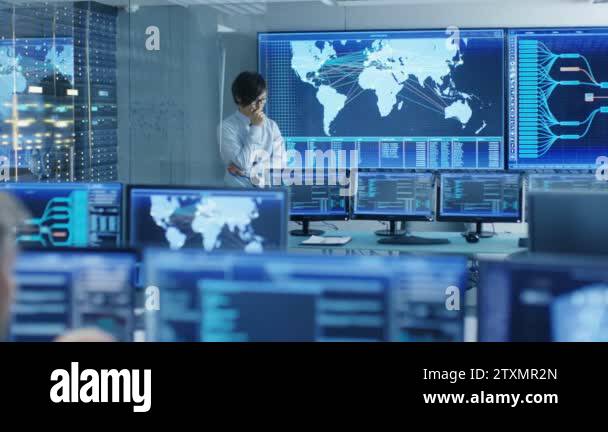 In the System Control Room Chief Engineer Thinks While Standing Before ...
