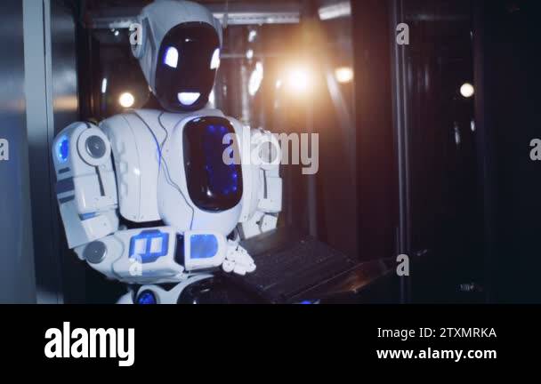 Cyborg types on a laptop in a server room Stock Video Footage - Alamy