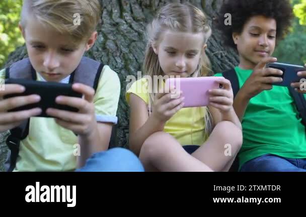 Children playing under tree in park Stock Videos & Footage - HD and 4K ...