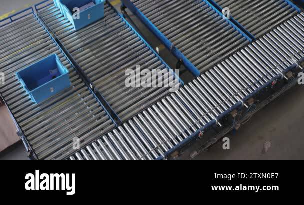 Plastic Boxes at Conveyor Rollers in Distribution Warehouse Top View ...