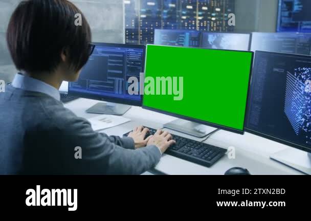 Technical Controller/ Operator Working at His Workstation with Multiple ...