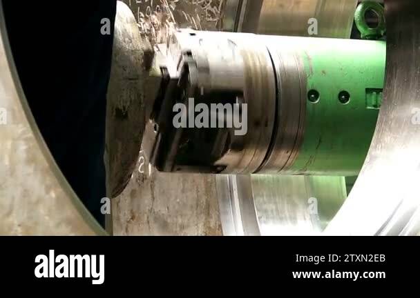 huge lathe closeup, large spindle lathe is rotating at an industrial ...
