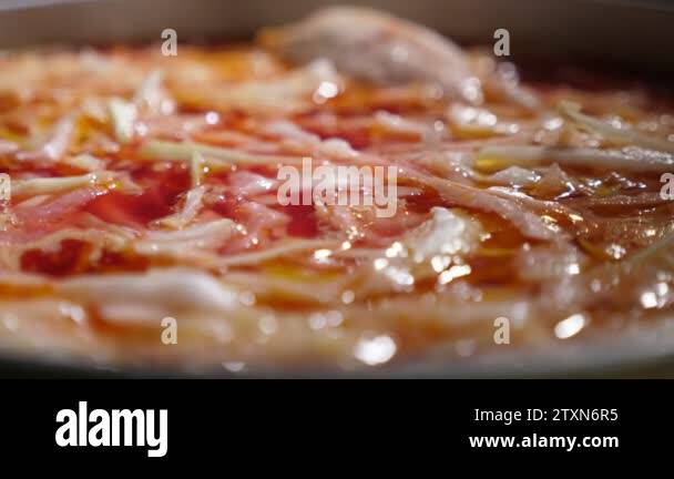 Traditional Ukrainian borscht is boiling in a big metallic casserole in ...