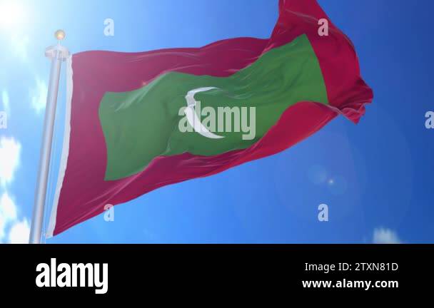 Maldives animated flag in the wind with blue sky in the background ...