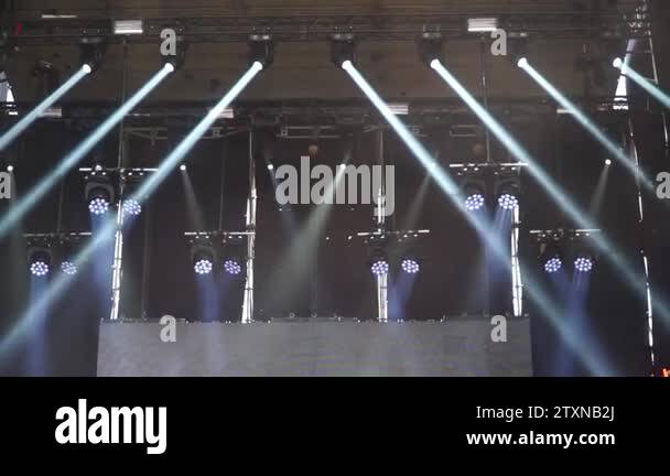 Stage lights are turned on during the concert blinking and shining ...