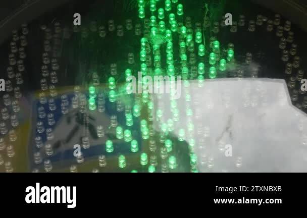 LEDs of the traffic light display with animation of a moving pedestrian ...