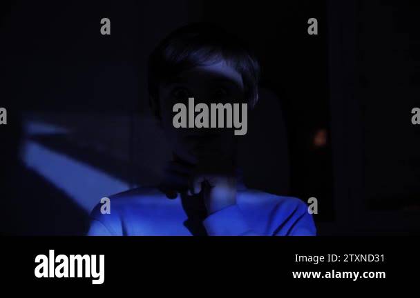 Little Scared Boy watching Horror Film or Video on TV or Computer in ...