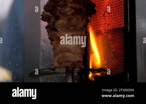 Traditional Turkish food Doner Kebab. Turnspit skewing kebap or kebab ...