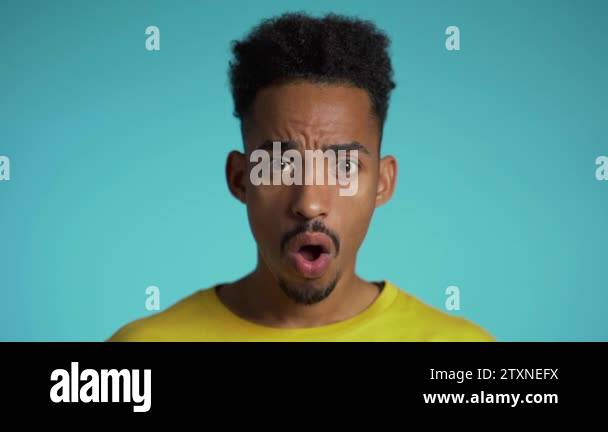 Amazed mixed race man shocked, saying WOW. Handsome african american ...