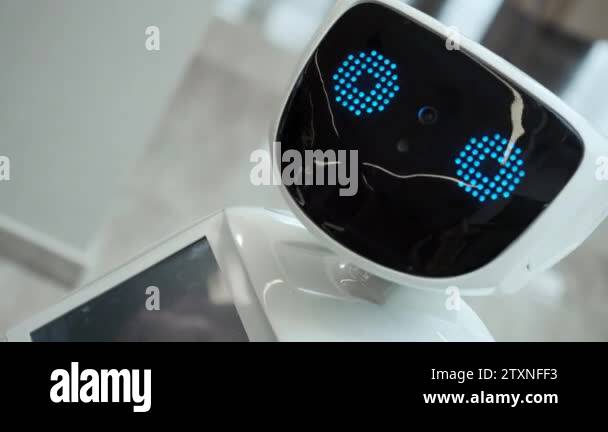 Modern Robotic Technologies. The robot looks at the camera at the ...