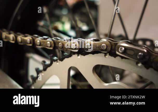 The rear wheel of the motorcycle to spin. chain and star closeup Stock ...