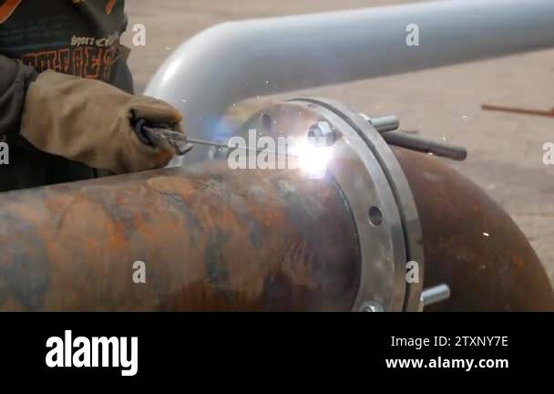 Welding pipe. Welder worker welding pipe by electrode. Electrodes for ...