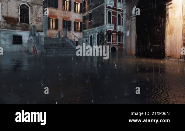 Flooded with water pavement and ancient bridge on empty venetian street ...
