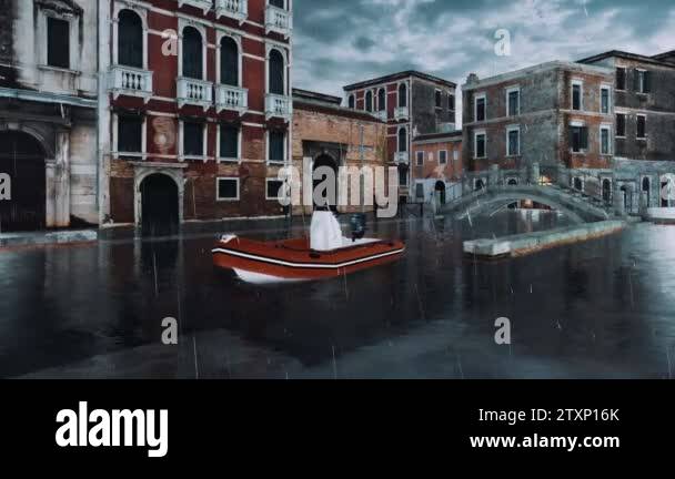 Empty flooded venetian street with ancient bridge over canal and ...