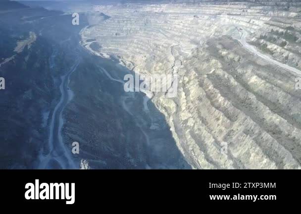 sharp border between shadow and sunny sides of asbestos pit Stock Video ...