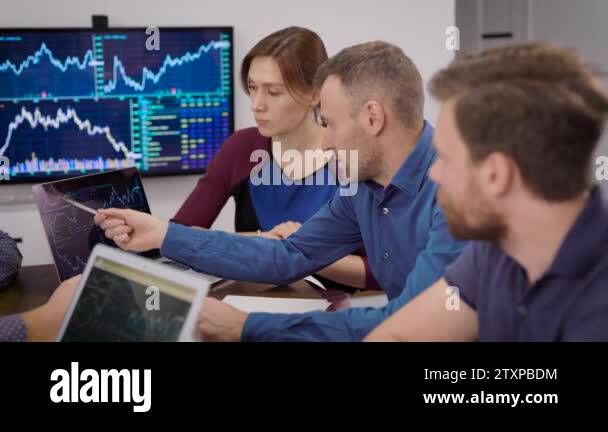 top management team is viewing diagrams and schedules of sales on ...