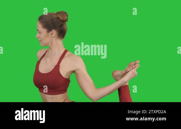 Beautiful young woman doing yoga exercise Eka Pada Rajakapotasana Pose ...