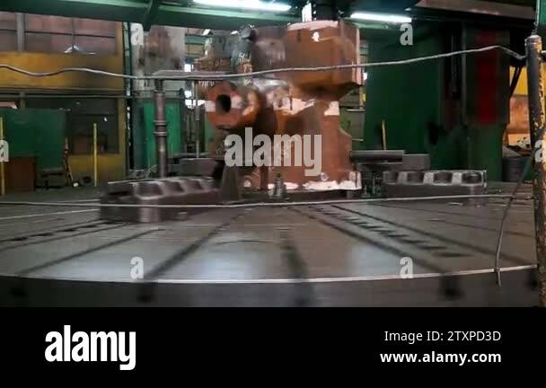 huge lathe closeup, large spindle lathe is rotating at an industrial ...
