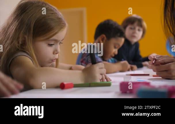 Cute engrossed little girl drawing at art lesson Stock Video Footage ...