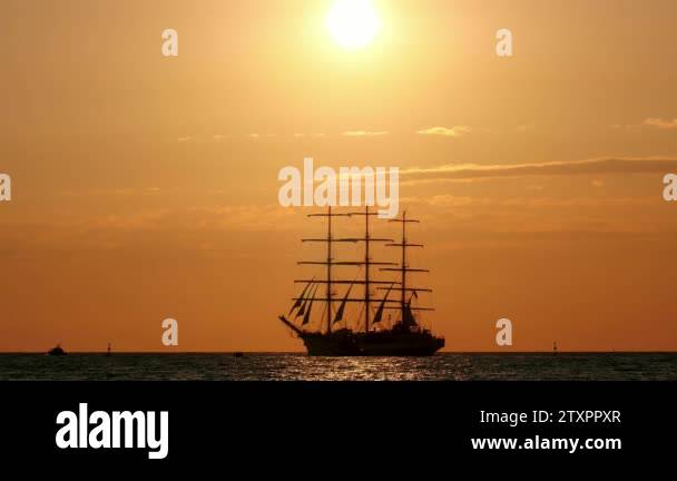 during sunset Beautiful silhouette sailing vessel in the sea. three ...