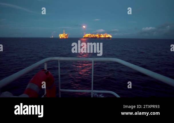 FPSO tanker vessel near Oil Rig platform. Offshore oil and gas industry ...