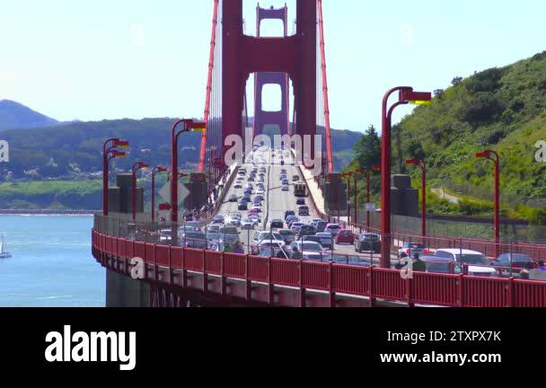 Traffic on the suspension bridge spanning the Golden Gate, the one-mile ...
