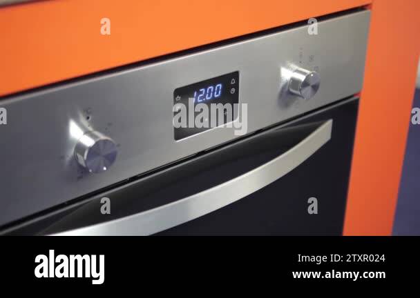 Metallic Toggle Switch of the Cooker Oven. Close-up View. Digital Clock ...