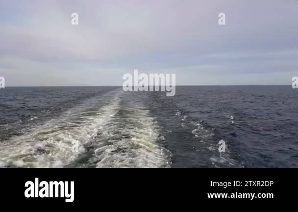 Powerful waves following the ship. Track from the engines of the ship ...