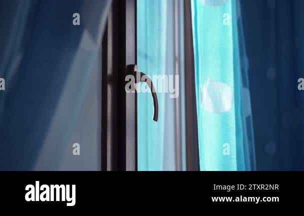 Plastic window turns the handle and opens partially upwards Stock Video ...