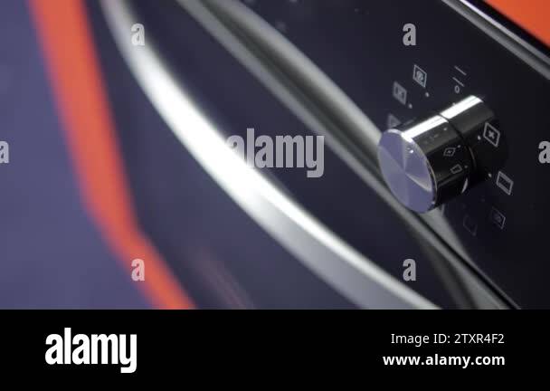 Metallic Toggle Switch of the Cooker Oven. Close-up View. Digital Clock ...