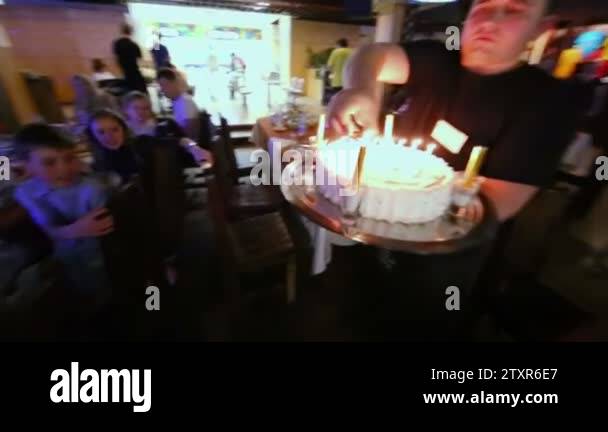 Waiter with birthday cake for kids Stock Video Footage - Alamy