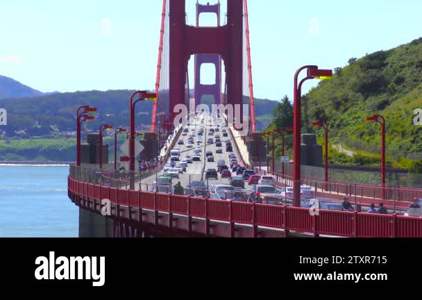 Traffic on the suspension bridge spanning the Golden Gate, the one-mile ...