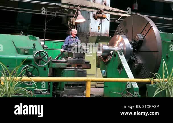 large spindle lathe is rotating at an industrial plant. Shooting is ...