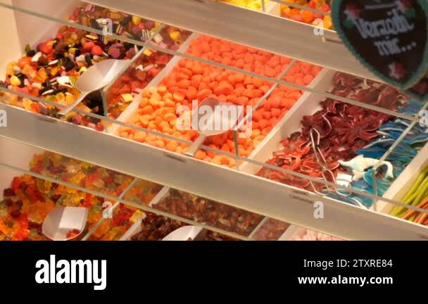 Assorted colorful jelly candies on counter at a food market store ...