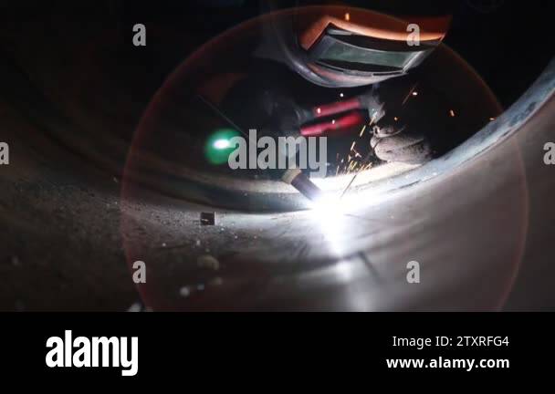 Video of the argon arc welding process inside a large diameter pipe. Root weld argon arc welding ...