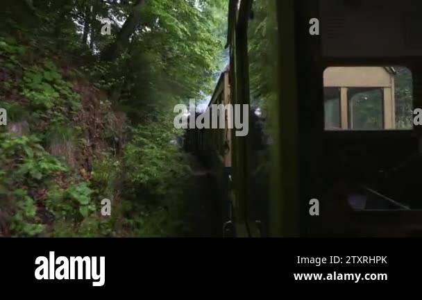 view from the roof of a retro train wagon, Old steam locomotive in ...