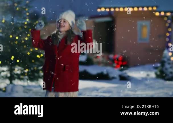 Cute Little Girl Dances in the Falling Snow. Child Enjoys Winter ...